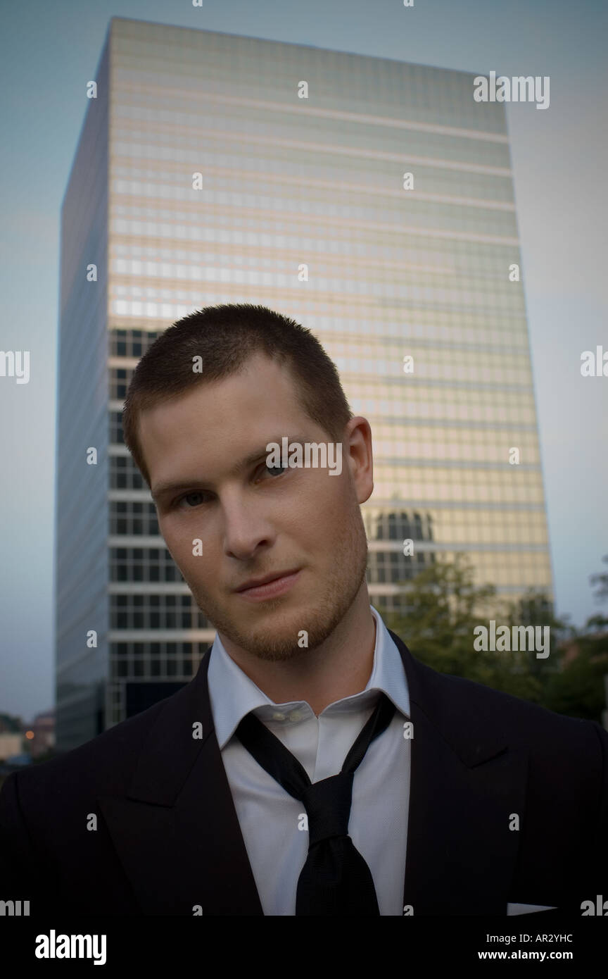 Man in front of corporate building Stock Photo - Alamy