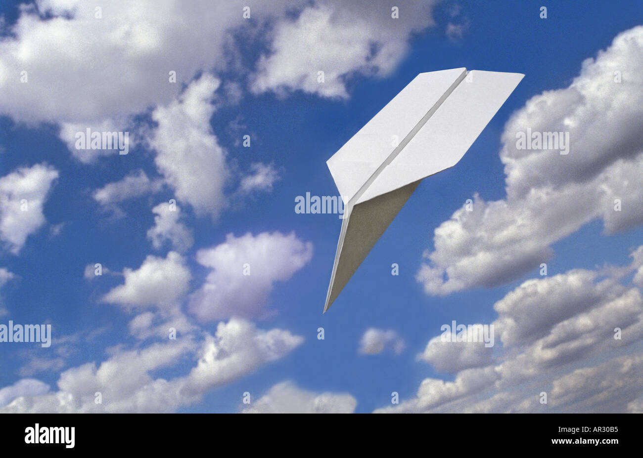 Paper airplane flying through the sky Stock Photo - Alamy
