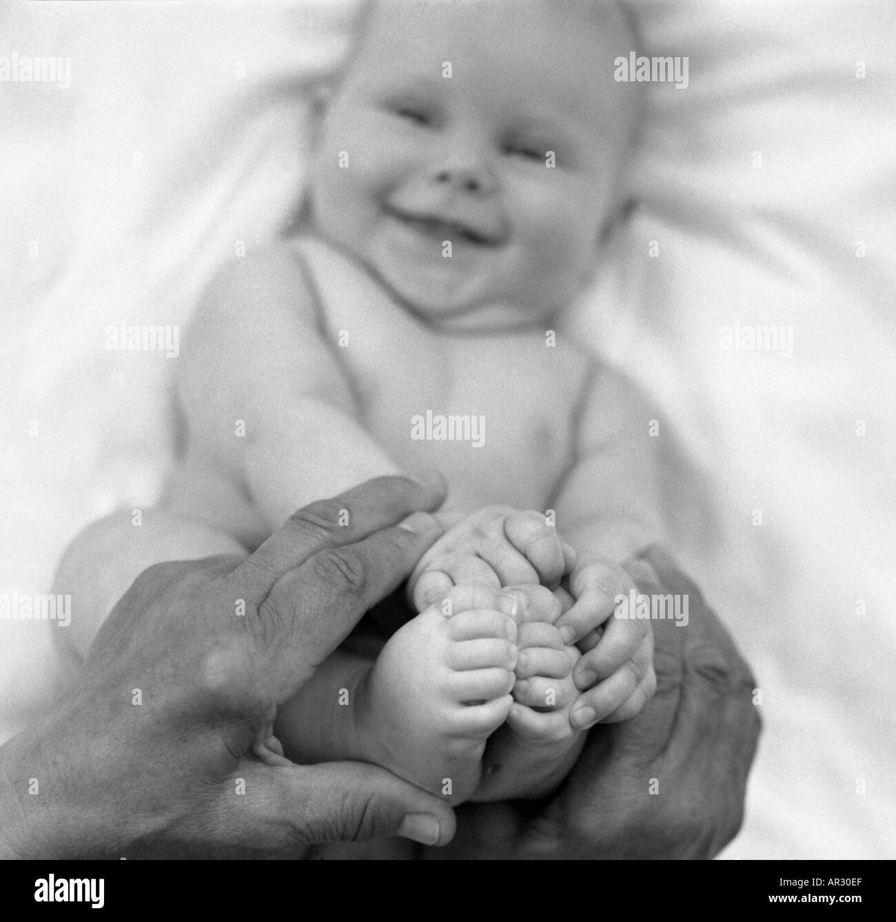 Adult baby laughing Black and White Stock Photos & Images - Alamy