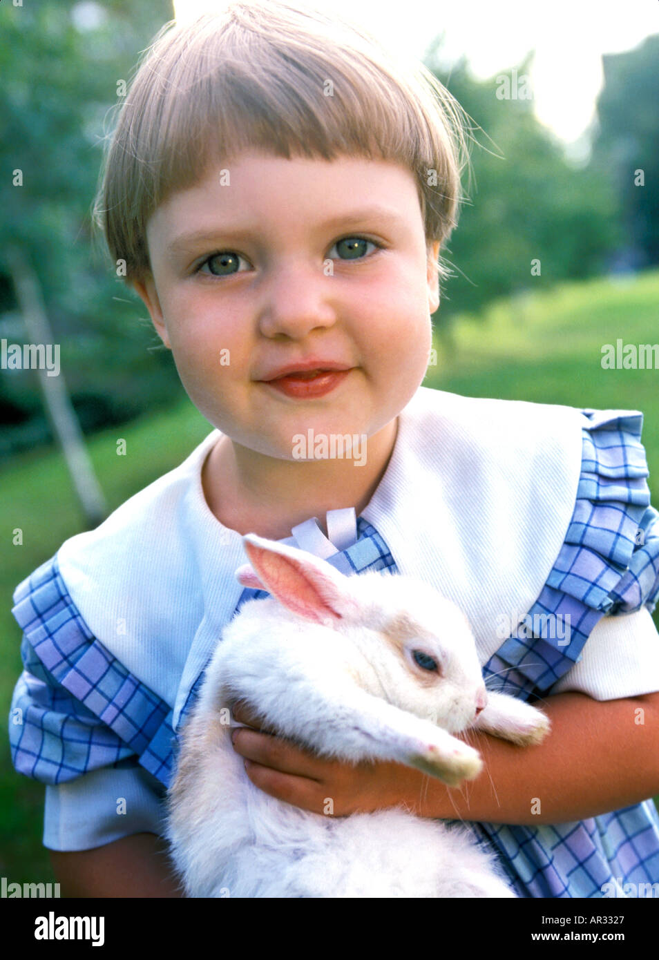 Child Girl with rabbit Stock Photo - Alamy