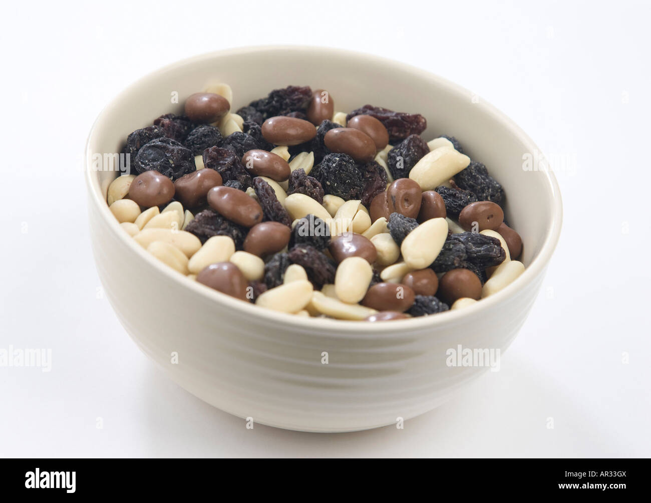 bowl of mixed peanuts, raisins and chocolate Stock Photo - Alamy