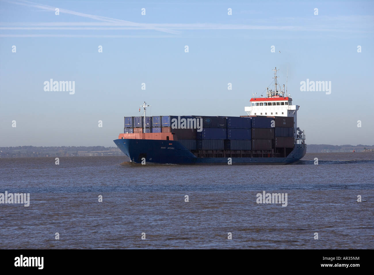 Container cargo ship sailing up the River Humber near Hull England UK ...