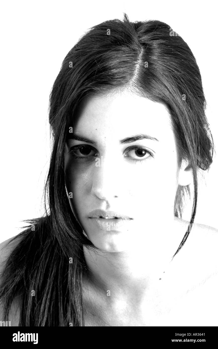 Black and white headshot of young black haired woman looking sullen ...