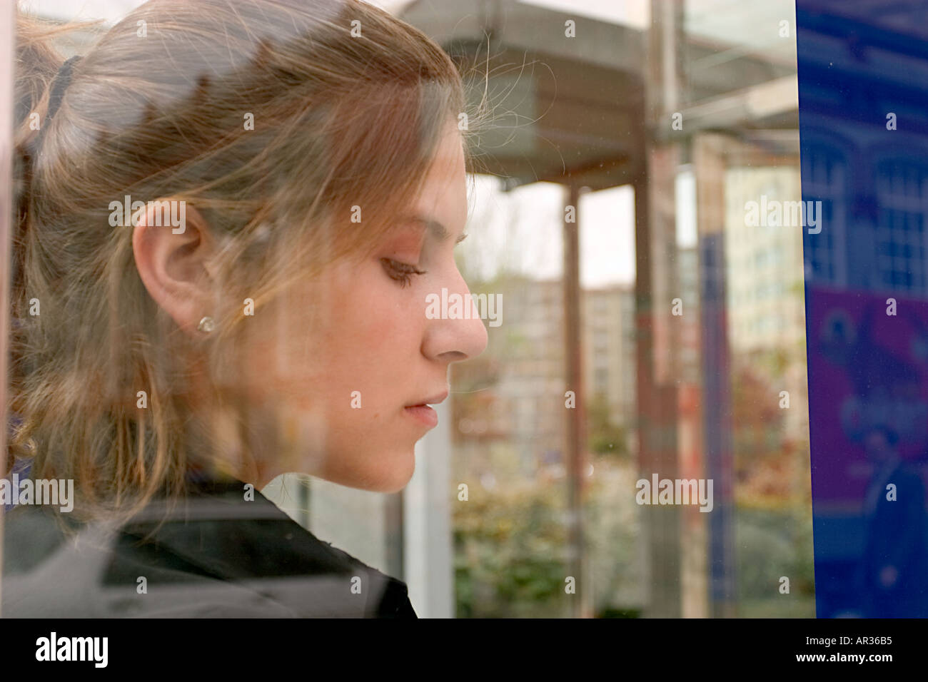 Woman behind a glass hi-res stock photography and images - Alamy