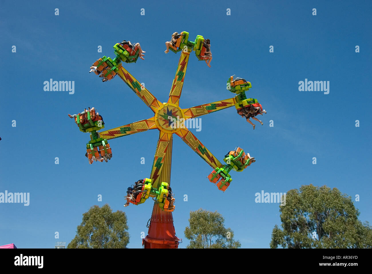 Crowds enjoying funfair rides in the sunshine, Royal Agricultural Show ...