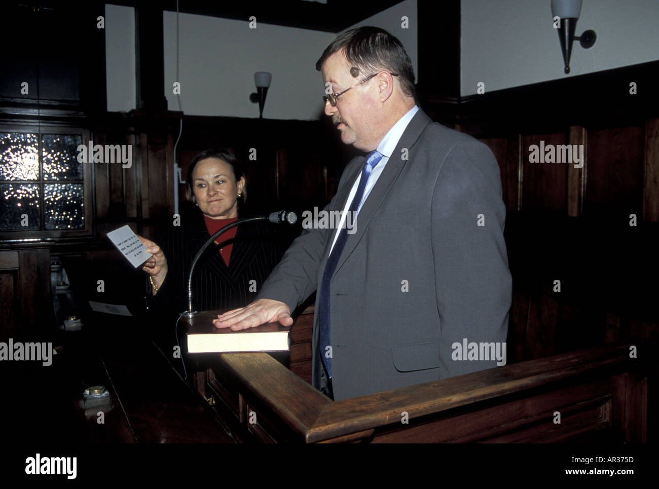 Witness taking the oath on the St James Bible in the Crown Courts ...
