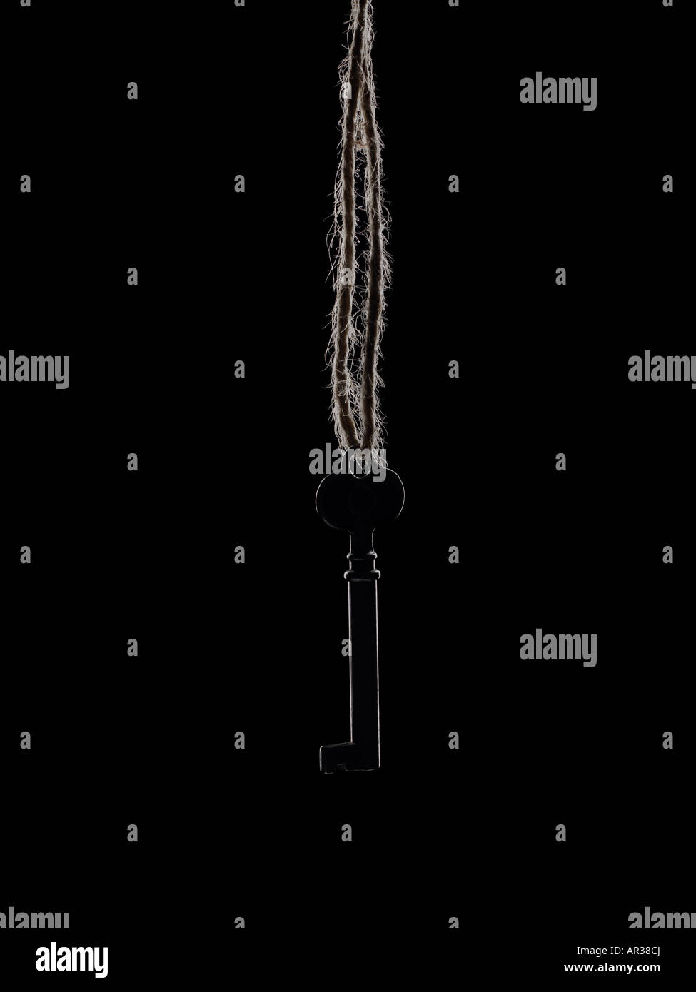 Key on string Stock Photo - Alamy