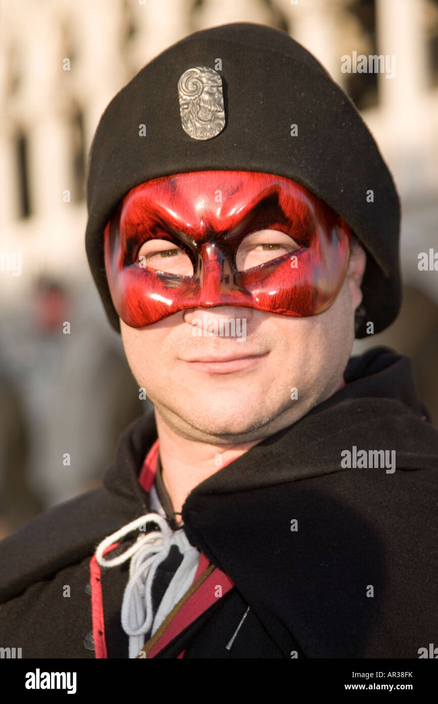 Reveller in mask and costume at the Venice carnival, in St Mark's ...
