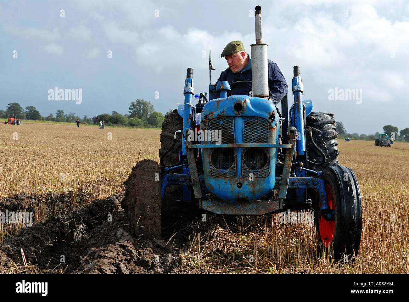 farmer on vintage tractor, ploughing match Stock Photo - Alamy