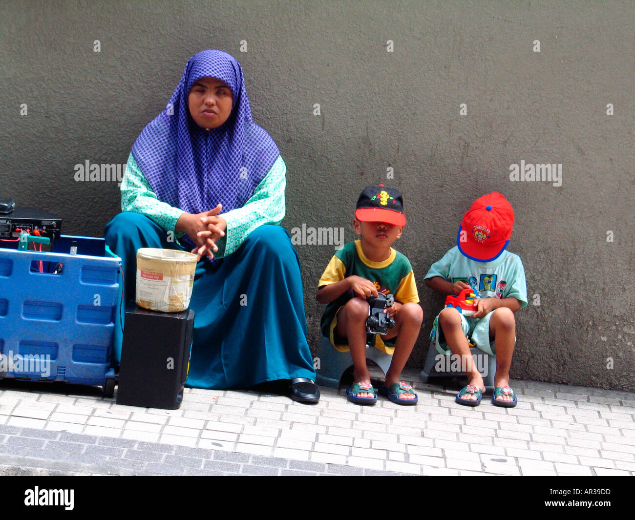 Blind singer with her children Stock Photo - Alamy