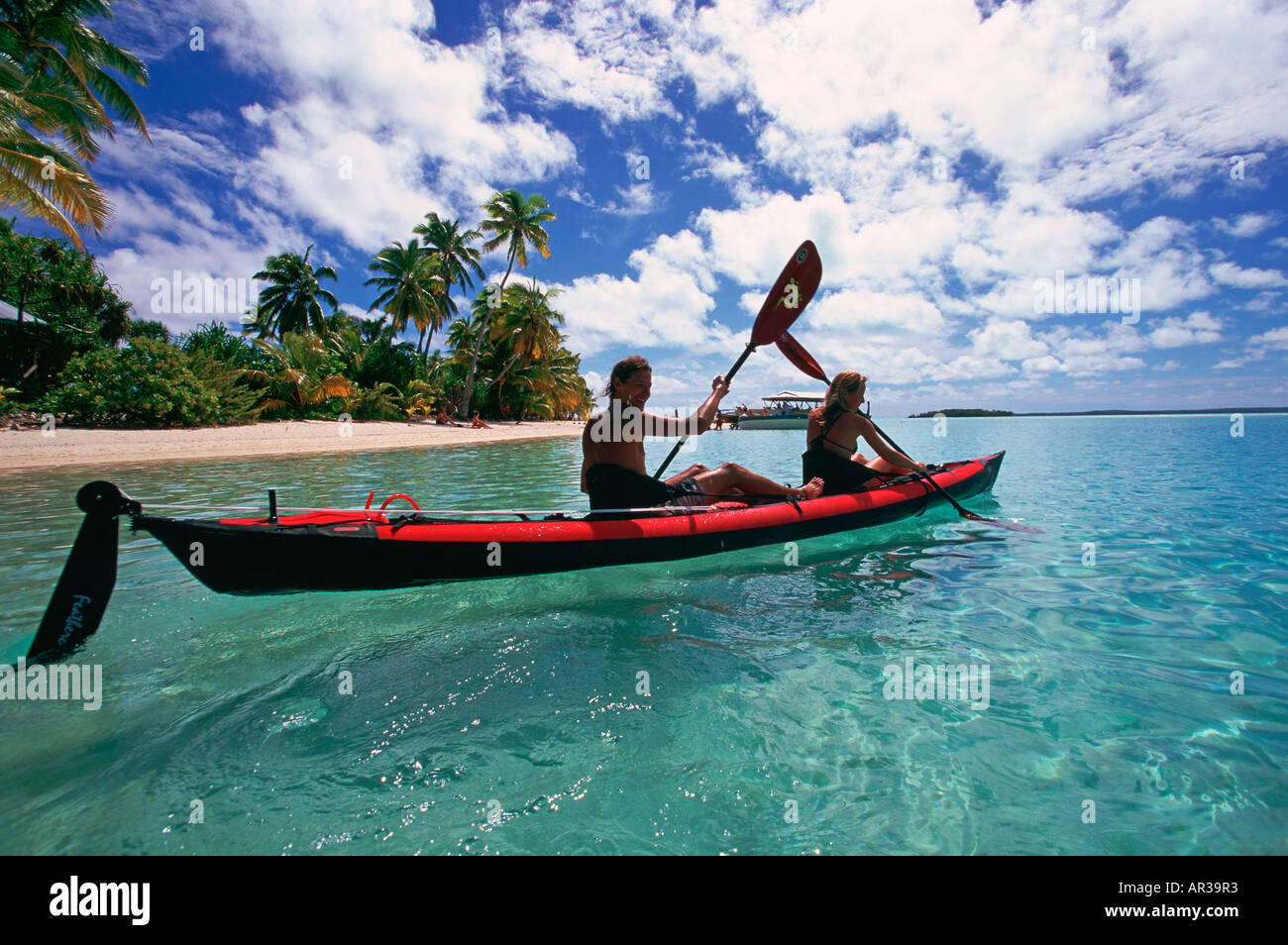 Couple on Kayak Aitutaki Cook Islands Stock Photo - Alamy