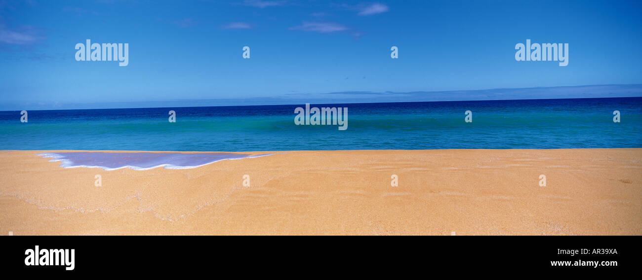 Wave coming over beach Stock Photo - Alamy
