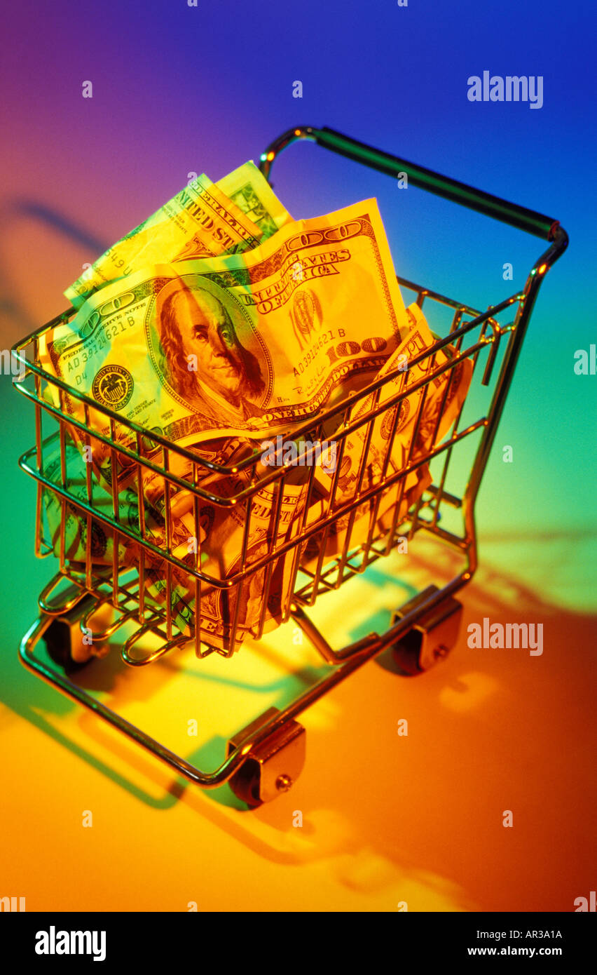 Shopping cart full of money Stock Photo - Alamy