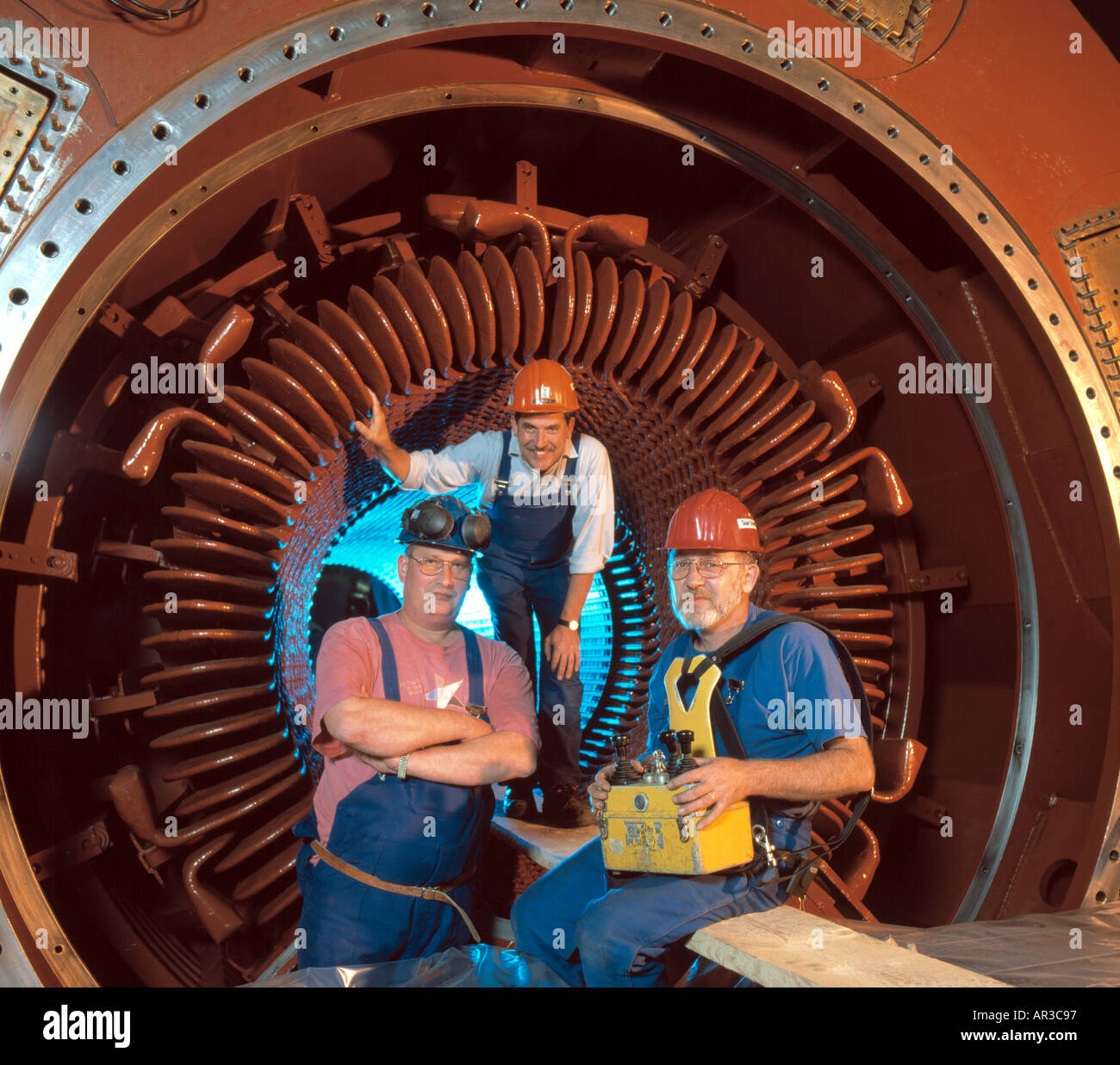 group of workers at a power stations generator Stock Photo - Alamy