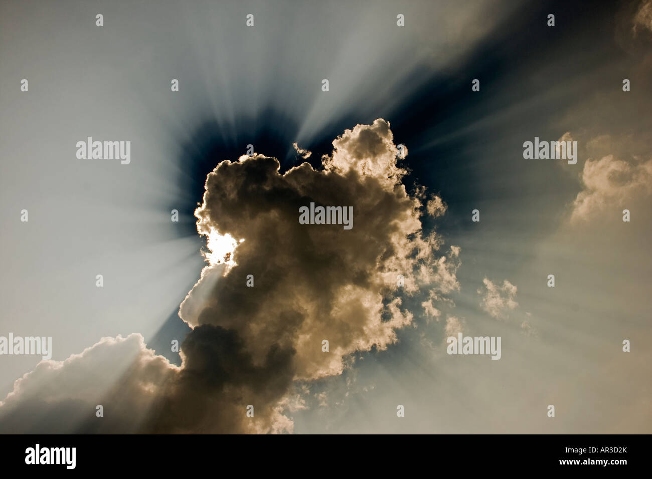 Rays of Buddha. Sun behind clouds Stock Photo - Alamy