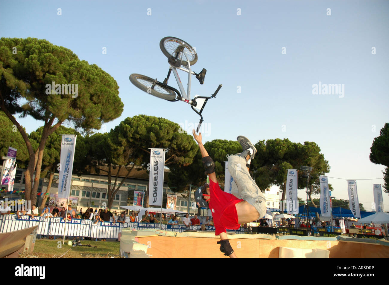 Extreme Bicycle sport jump The rider hanging below the bike Stock Photo ...