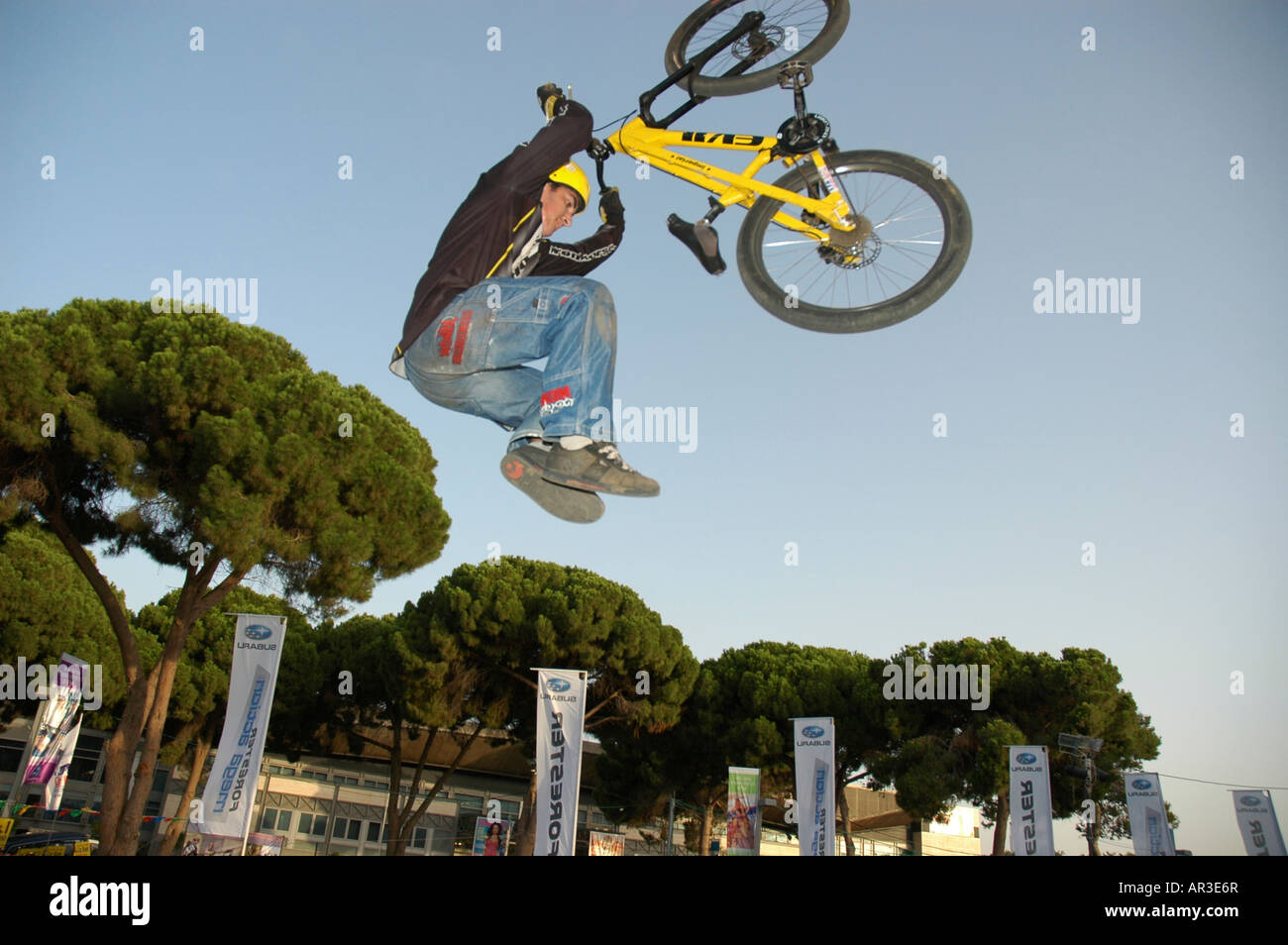 Extreme Bicycle sport jump The rider hanging below the bike Stock Photo ...