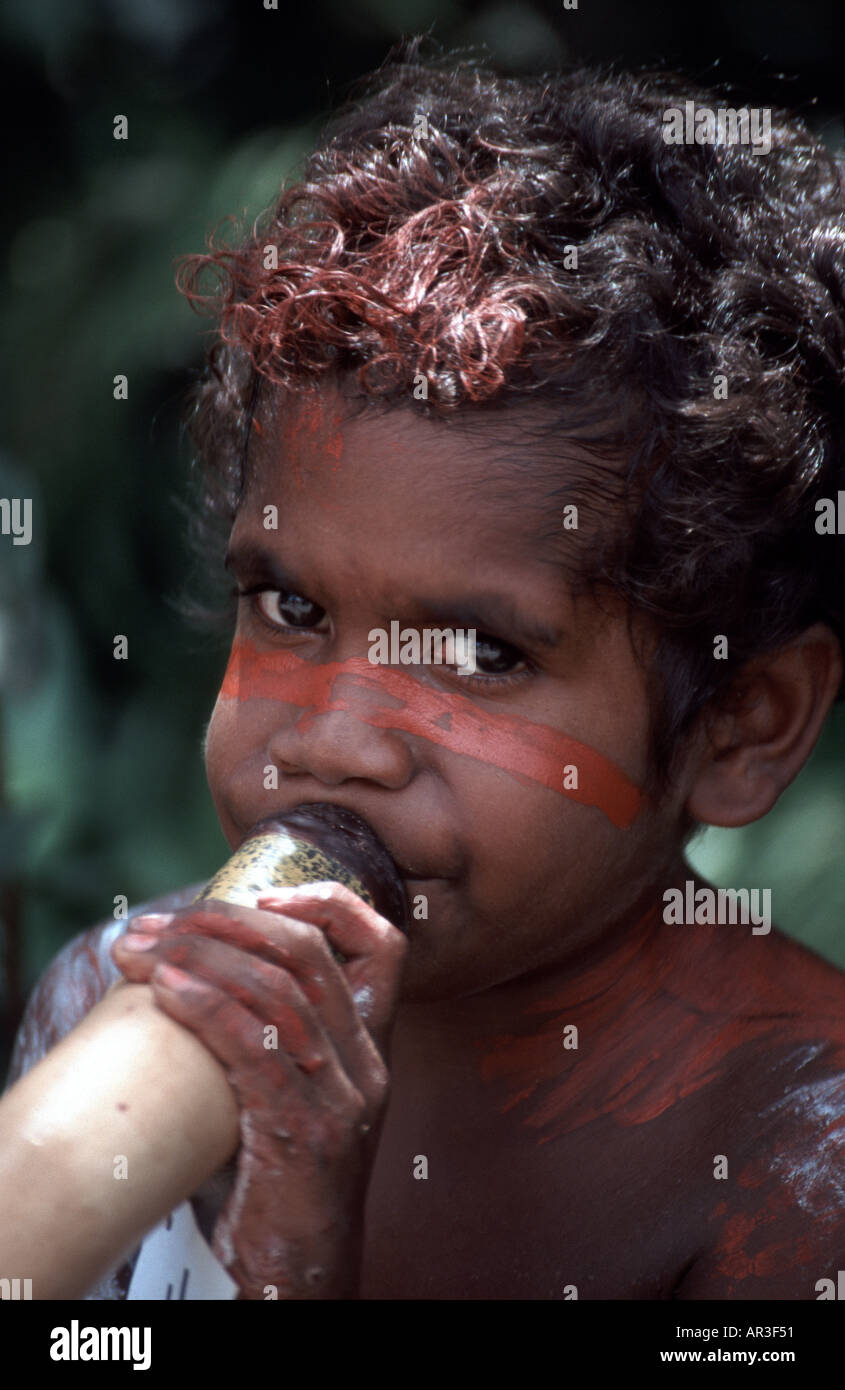 Australian aboriginal boy playing didgeridoo Stock Photo - Alamy