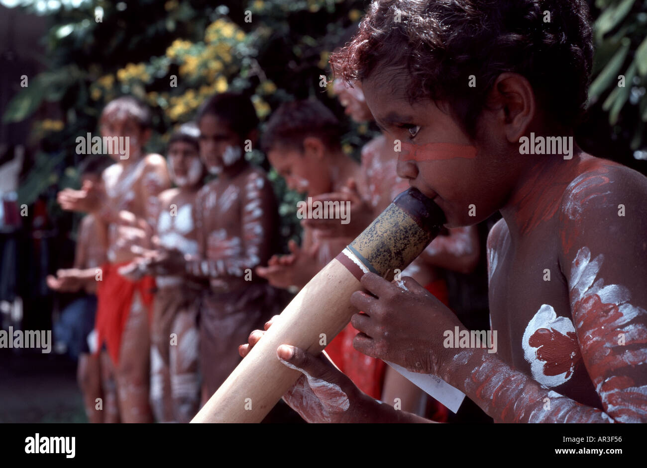 Australian aboriginal boy playing didgeridoo Stock Photo - Alamy