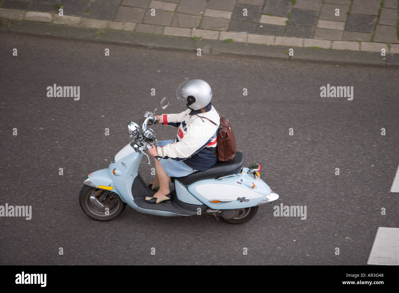 HOLLAND AMSTERDAM TOP VIEW WOMAN RIDING AN APRILIA MOJITO SCOOTER Stock ...