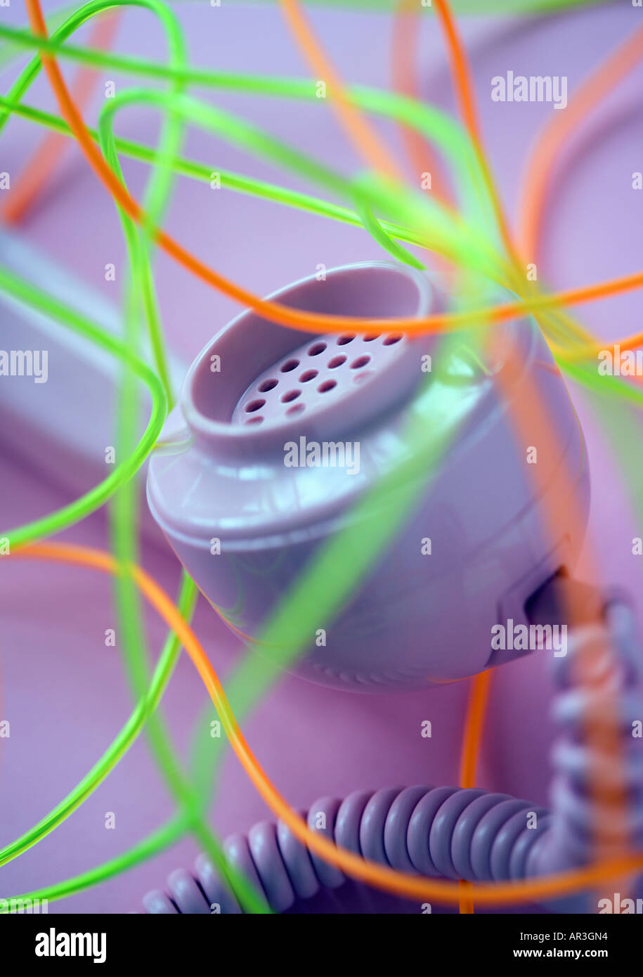 Blue telephone receiver with multi coloured wires Stock Photo - Alamy