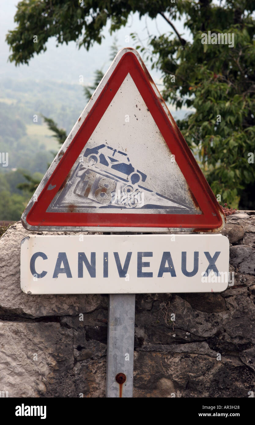 Gutter in road caniveaux and 18 percent incline sign France Stock Photo ...
