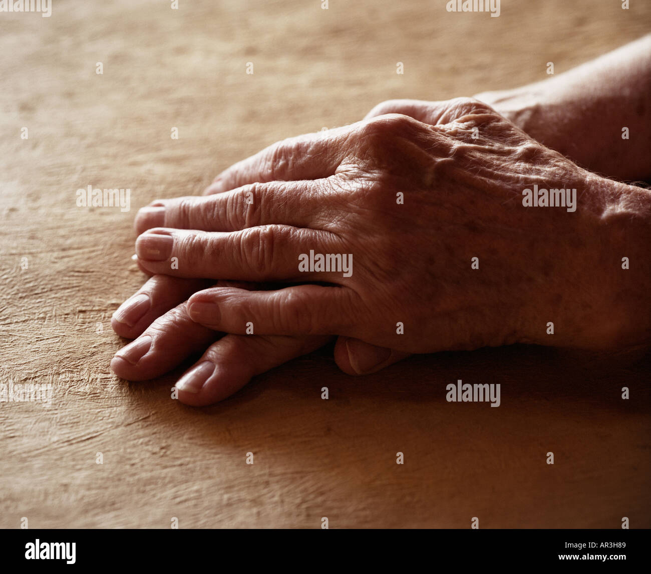 An elderly woman's hands overlapping contentedly Stock Photo - Alamy
