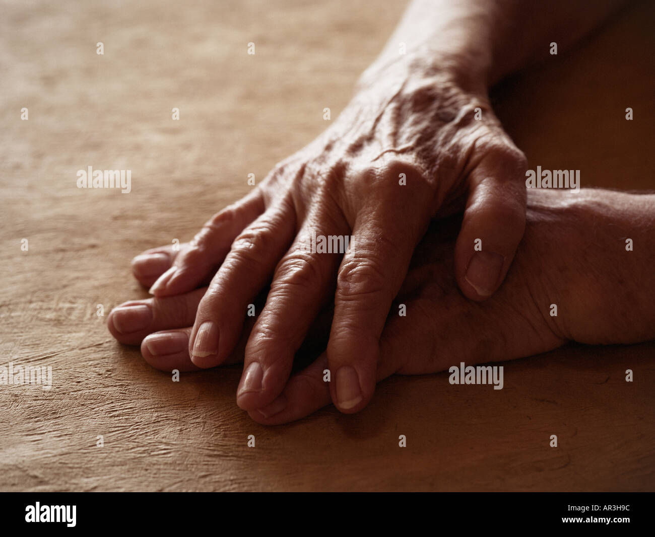 An elderly woman's hands overlapping contentedly Stock Photo - Alamy