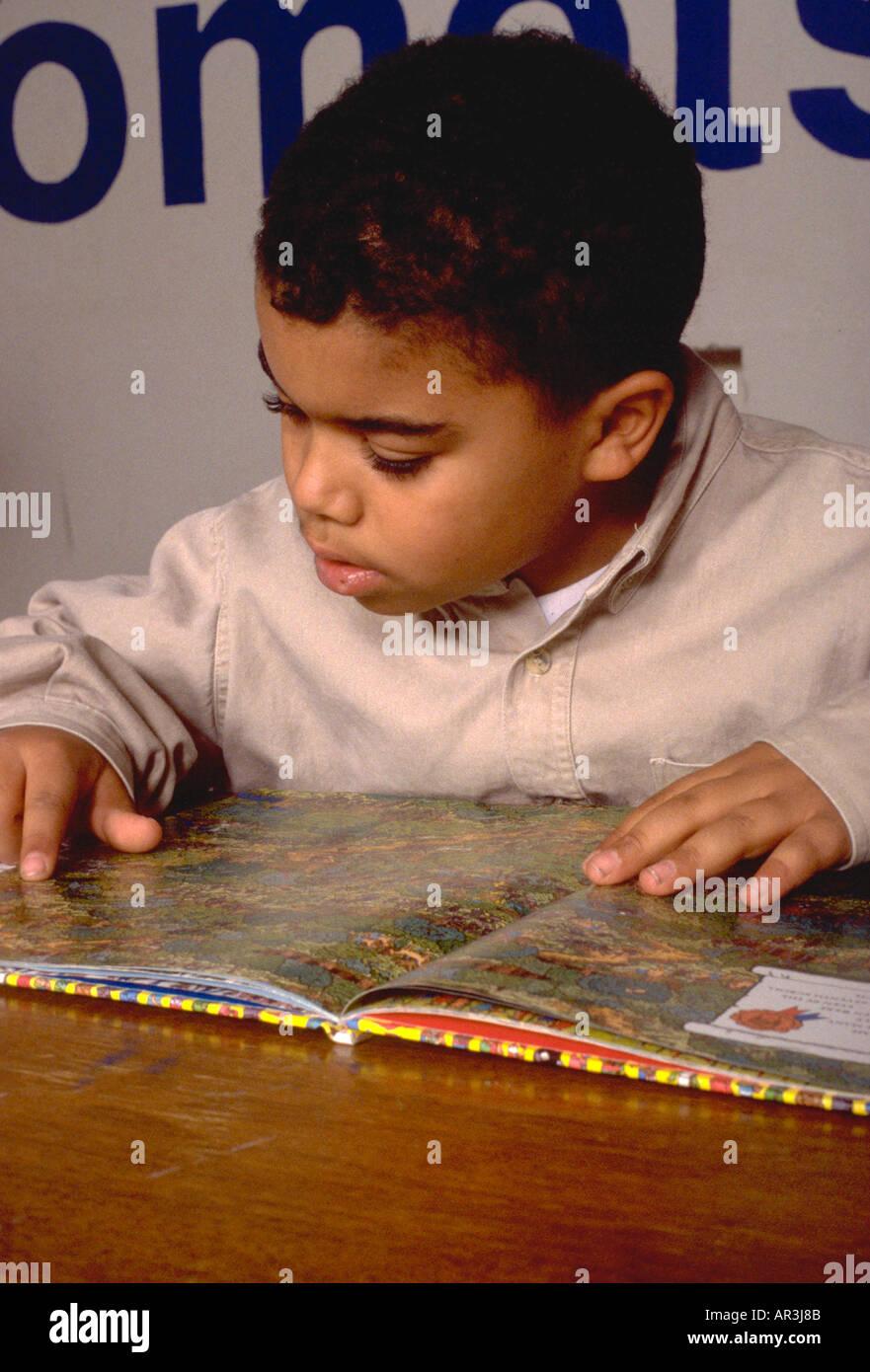 Black african minority student students boy boys male reading hi-res ...