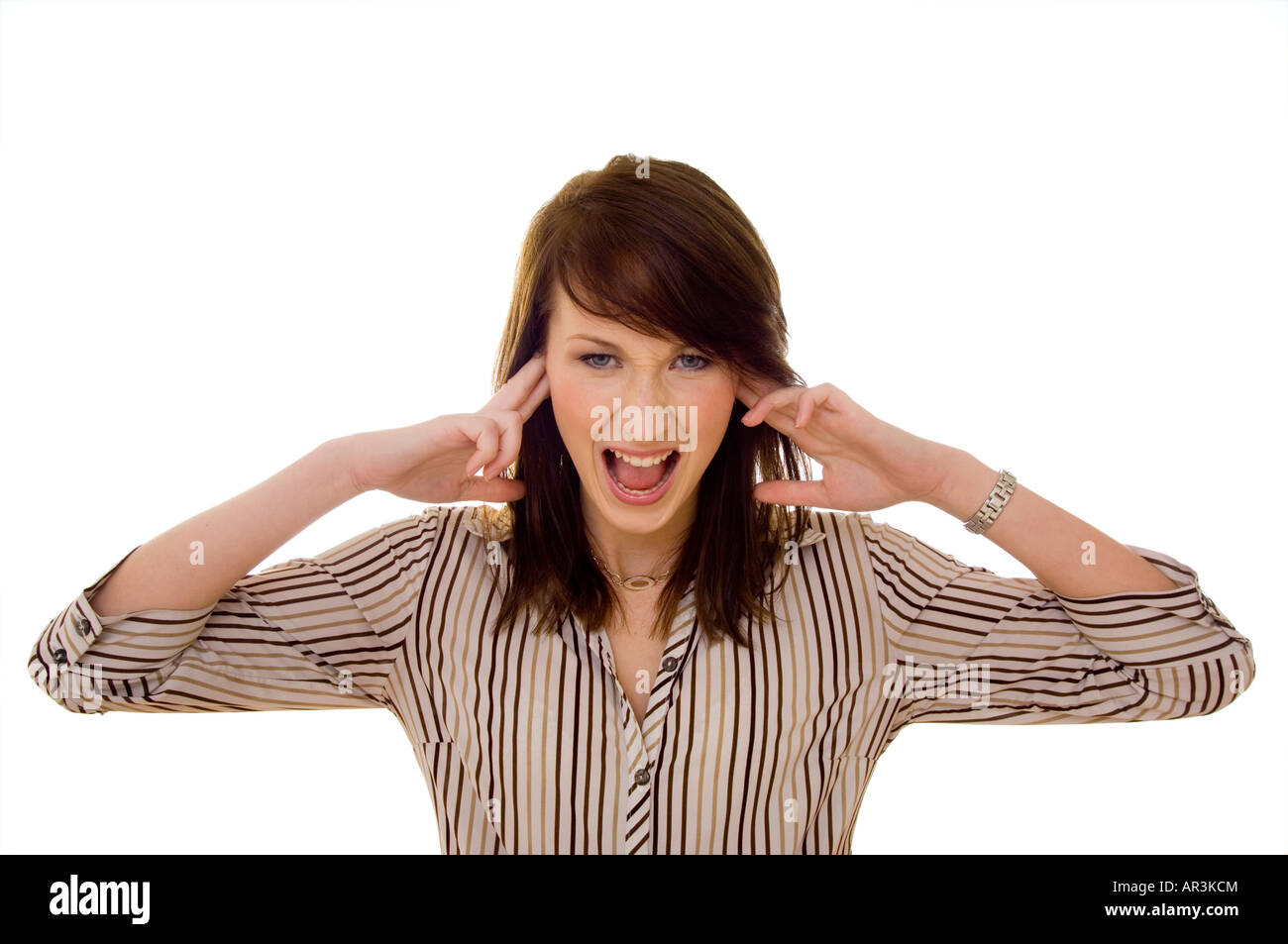 woman with her fingers in her ears shouting and screaming Stock Photo ...