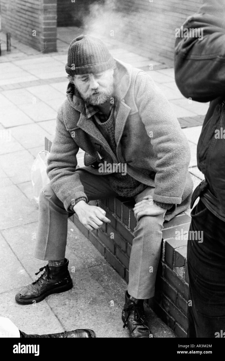 Black and white portrait of a homeless man smoking Stock Photo - Alamy