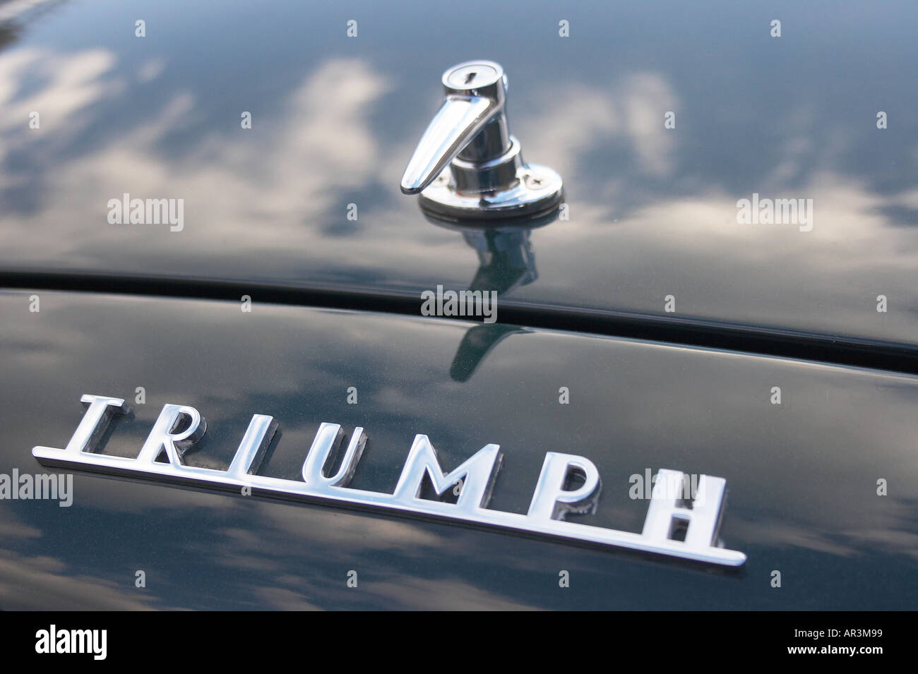 logo sign of Triumph oldtimer car with cloud reflection on paint Stock ...