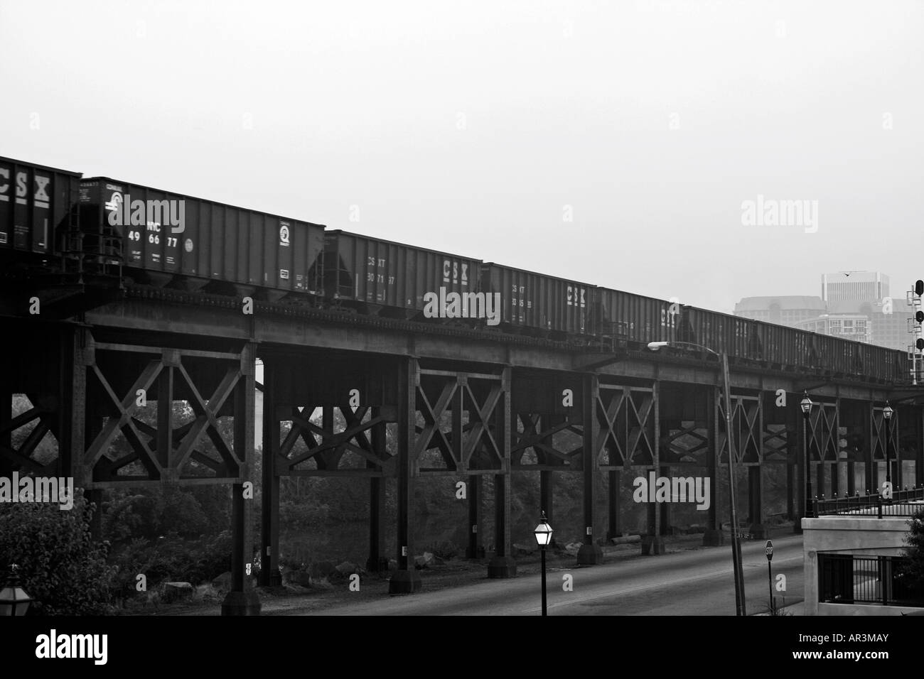 Train on raised railway bridge in Richmond, Virginia Stock Photo - Alamy