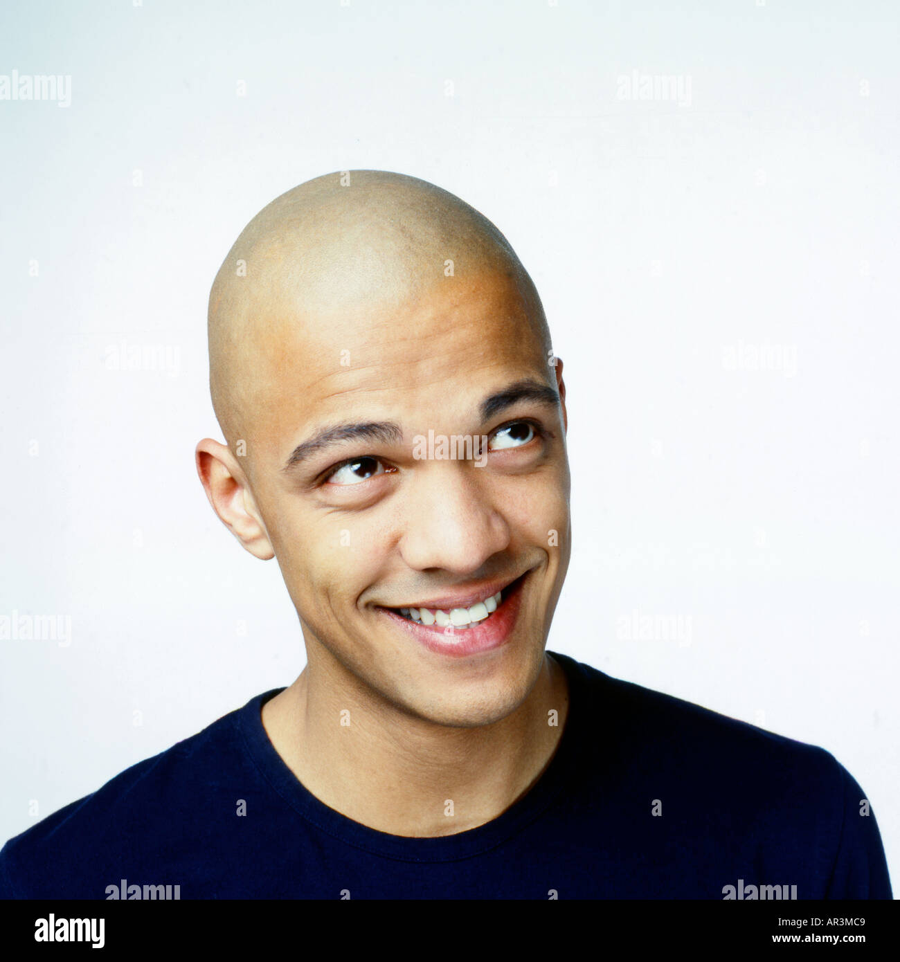portrait of young coulered man looking up close up head face white ...