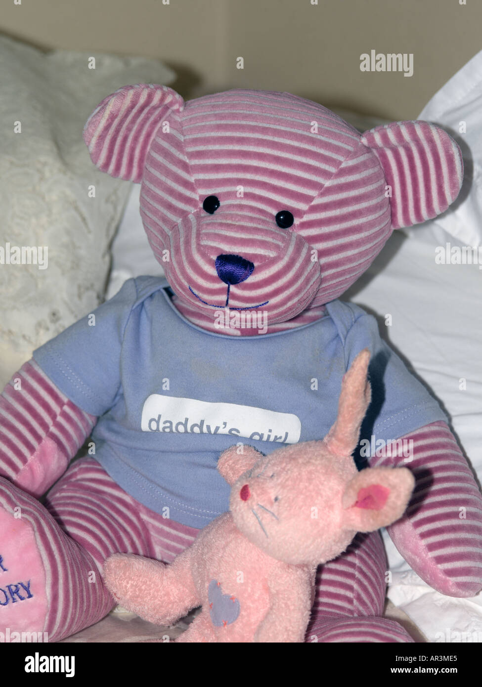 Pink Stripey Teddy Bear with Rabbit Stock Photo - Alamy