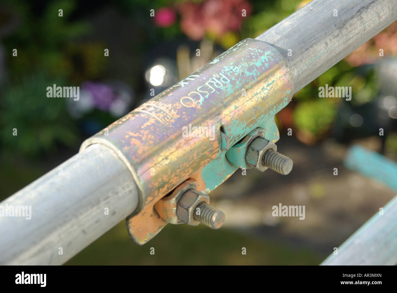 Close up of scaffold connection joining length of tube as handrail ...