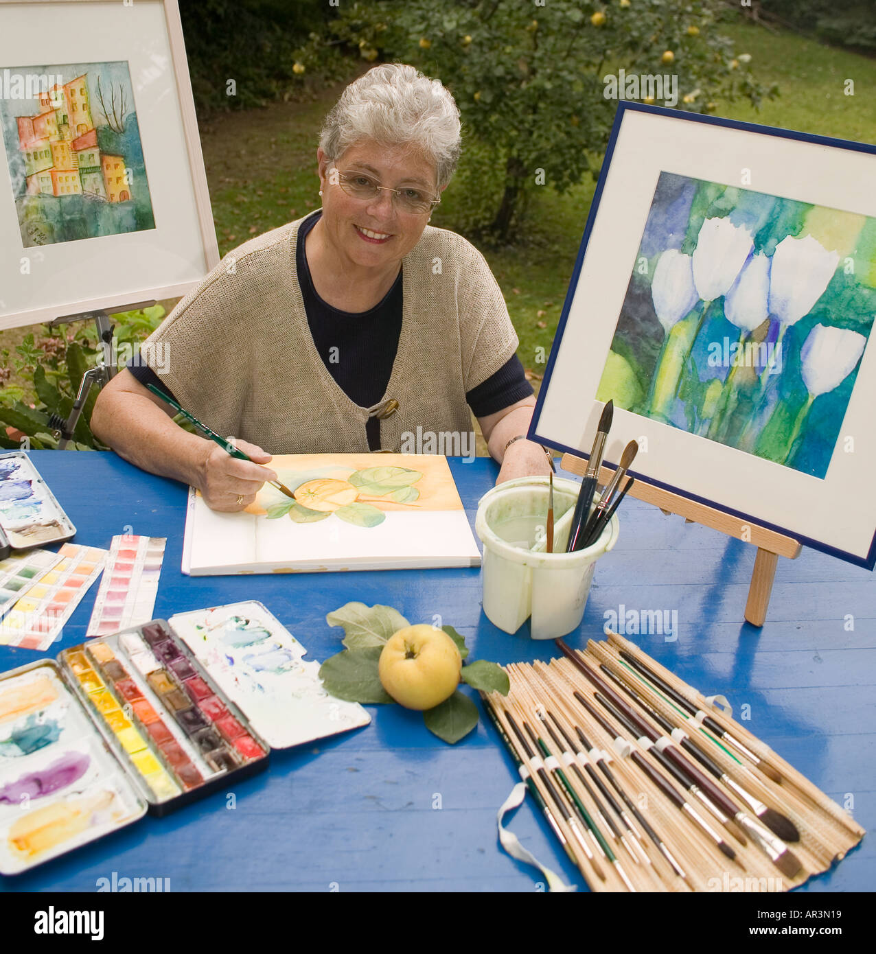 senior hobby artist painting with water colours Stock Photo - Alamy