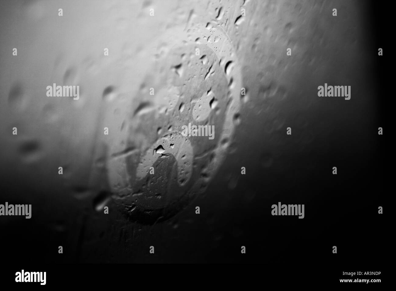 Sad face drawn on the condensation on a rainy window Stock Photo - Alamy