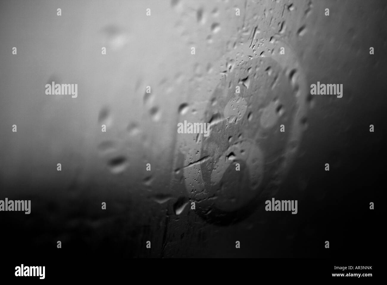 Sad face drawn on the condensation on a rainy window Stock Photo - Alamy