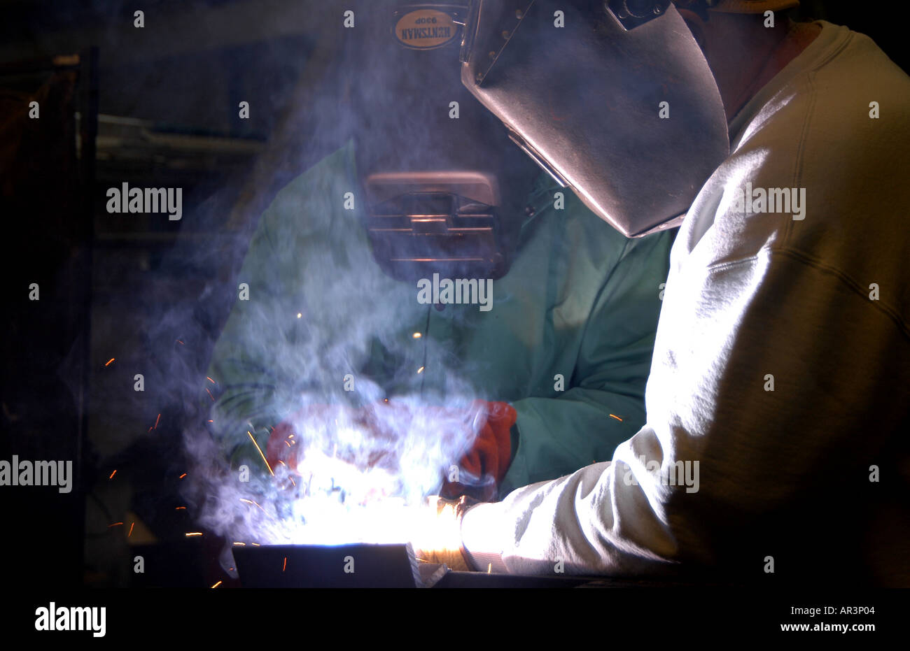 Kid learning about welding Stock Photo - Alamy