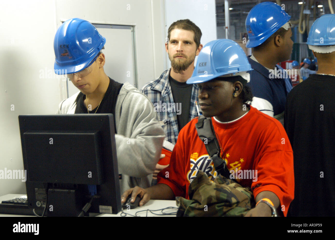 Kids at computer learning construction trade Stock Photo - Alamy