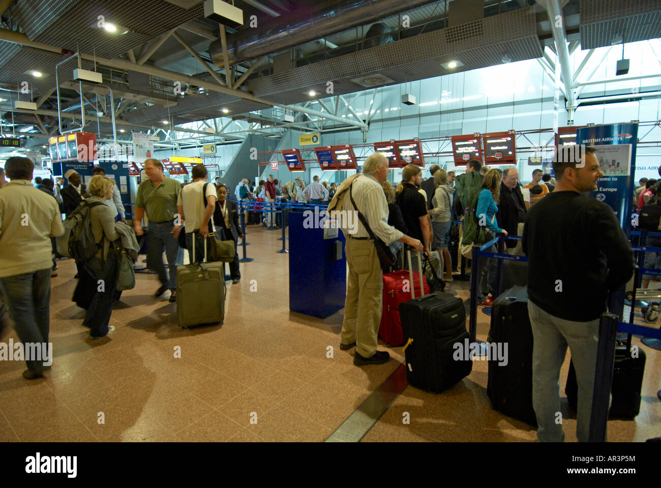 Passengers waiting in line for check in, BAA London Heathrow T4 Stock ...