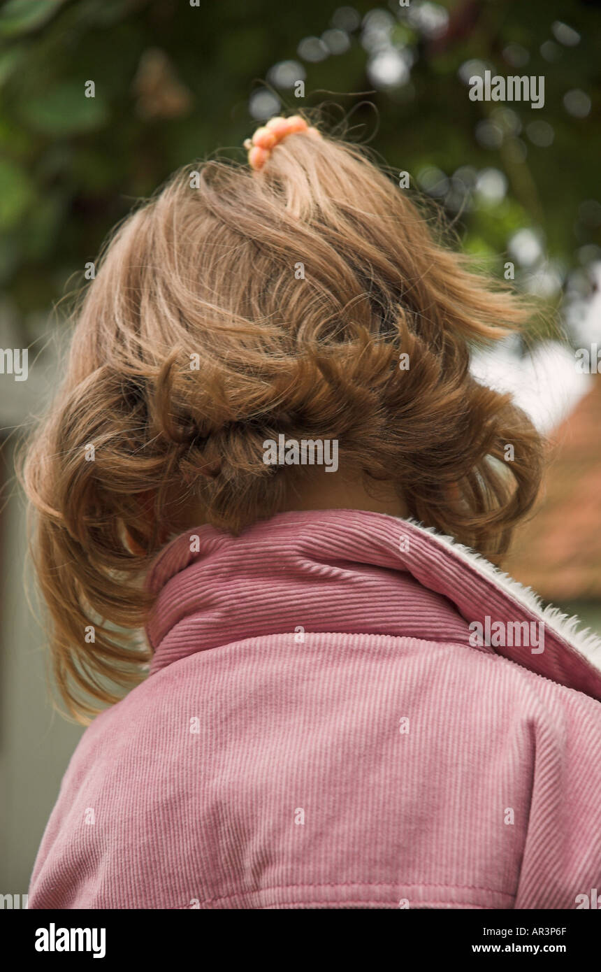 Young girl with blonde hair rear view Stock Photo - Alamy