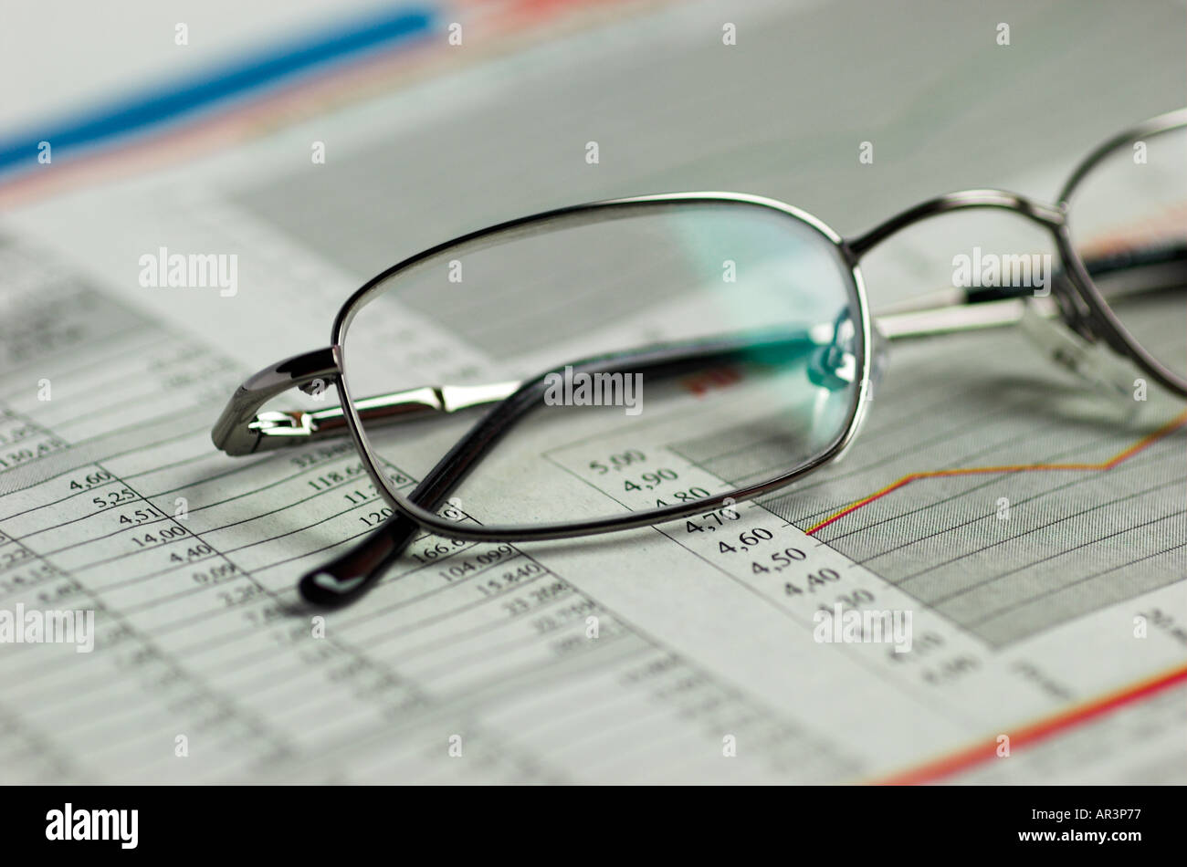 Eyeglasses on newspaper financial stock market report Stock Photo - Alamy