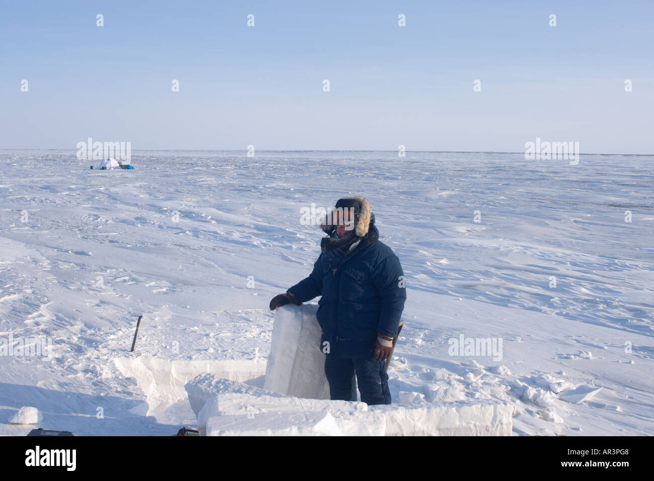 photographer Steven Kazlowski helps build an igloo snow blind along the ...