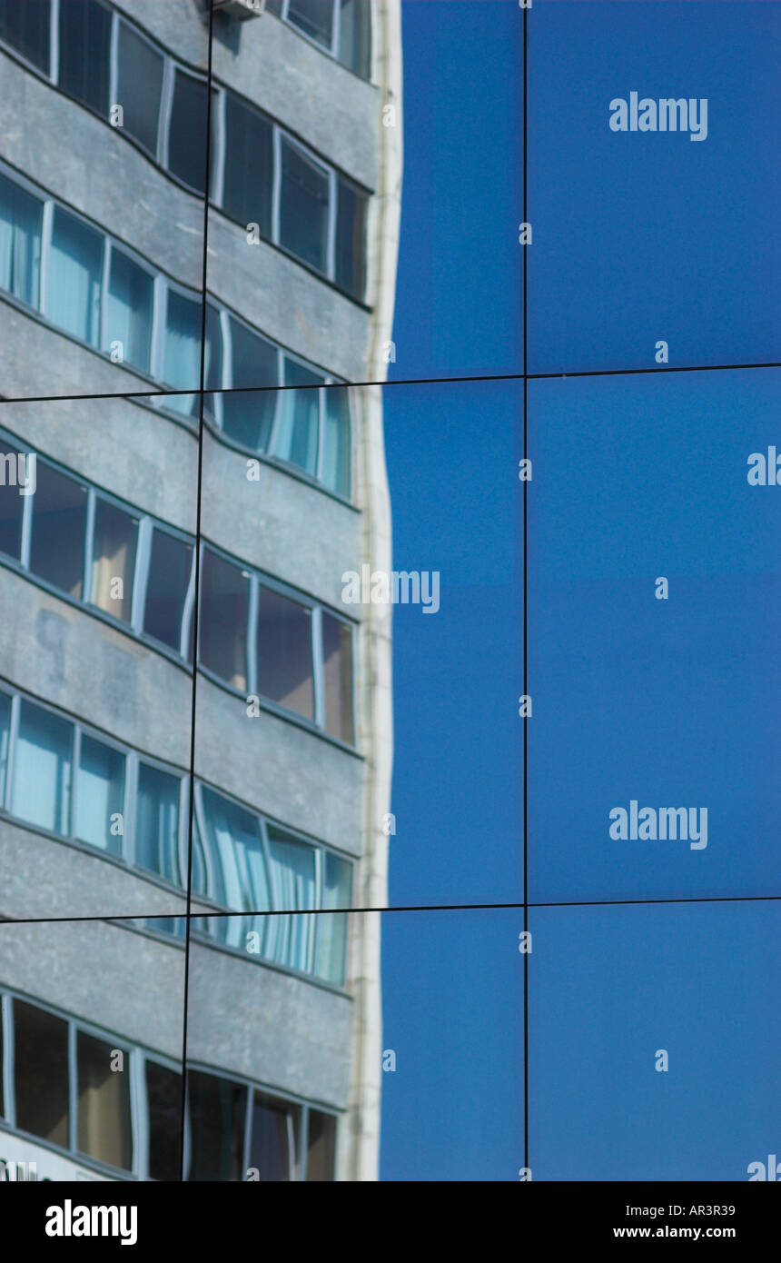 Office building reflected in windows Stock Photo - Alamy