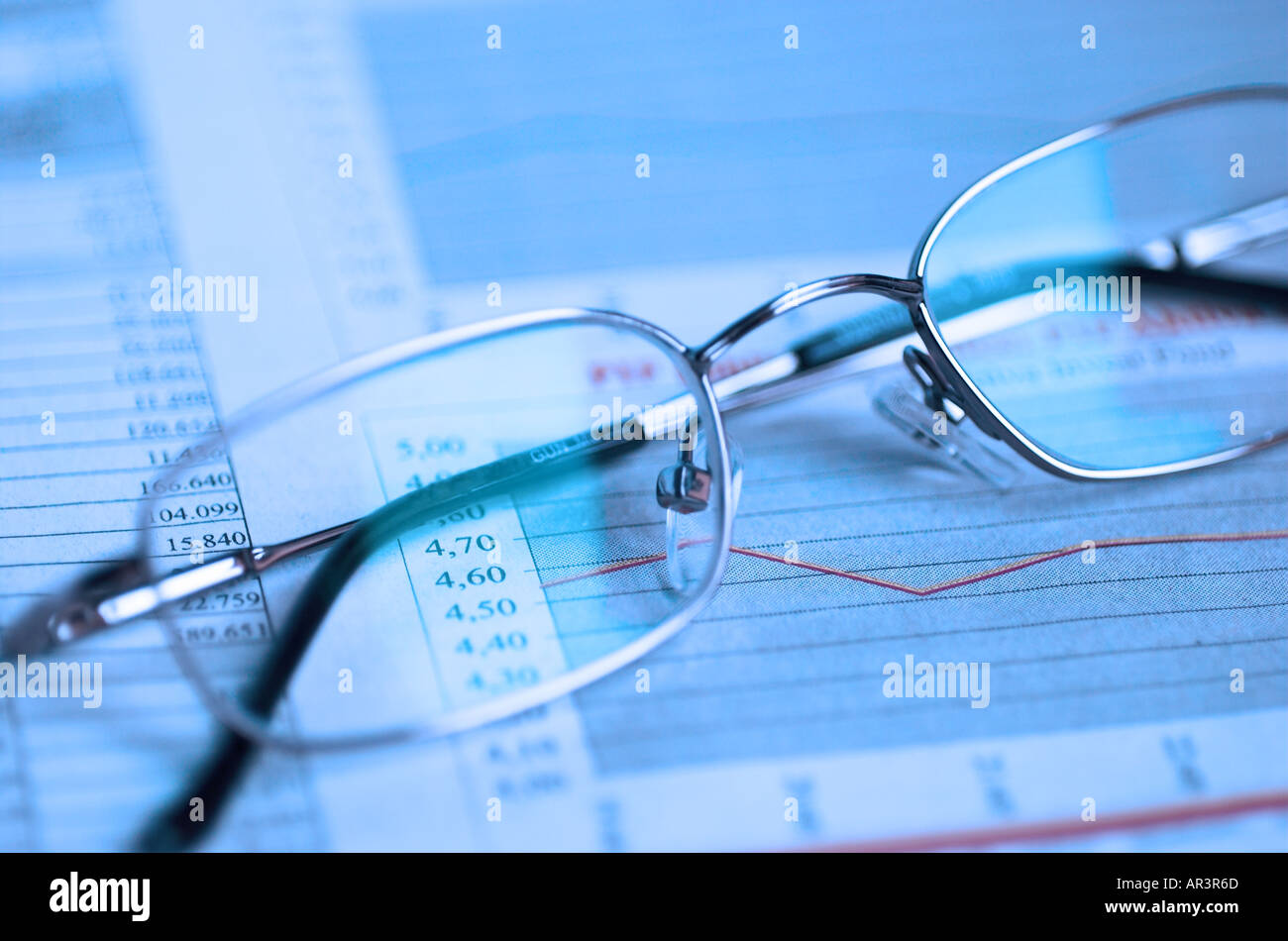 Eyeglasses on newspaper financial stock market report Stock Photo - Alamy
