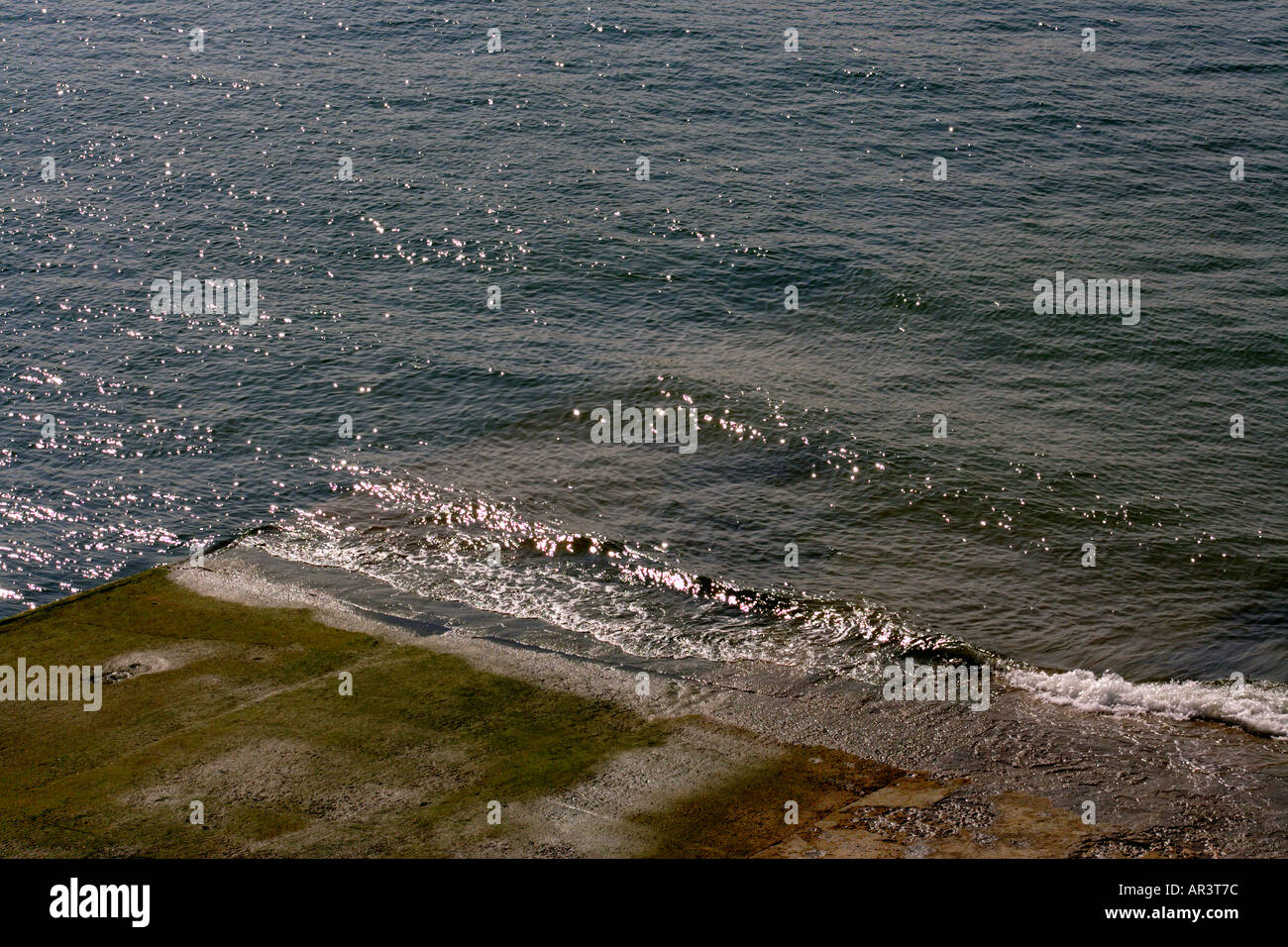Water dashing ashore Stock Photo - Alamy