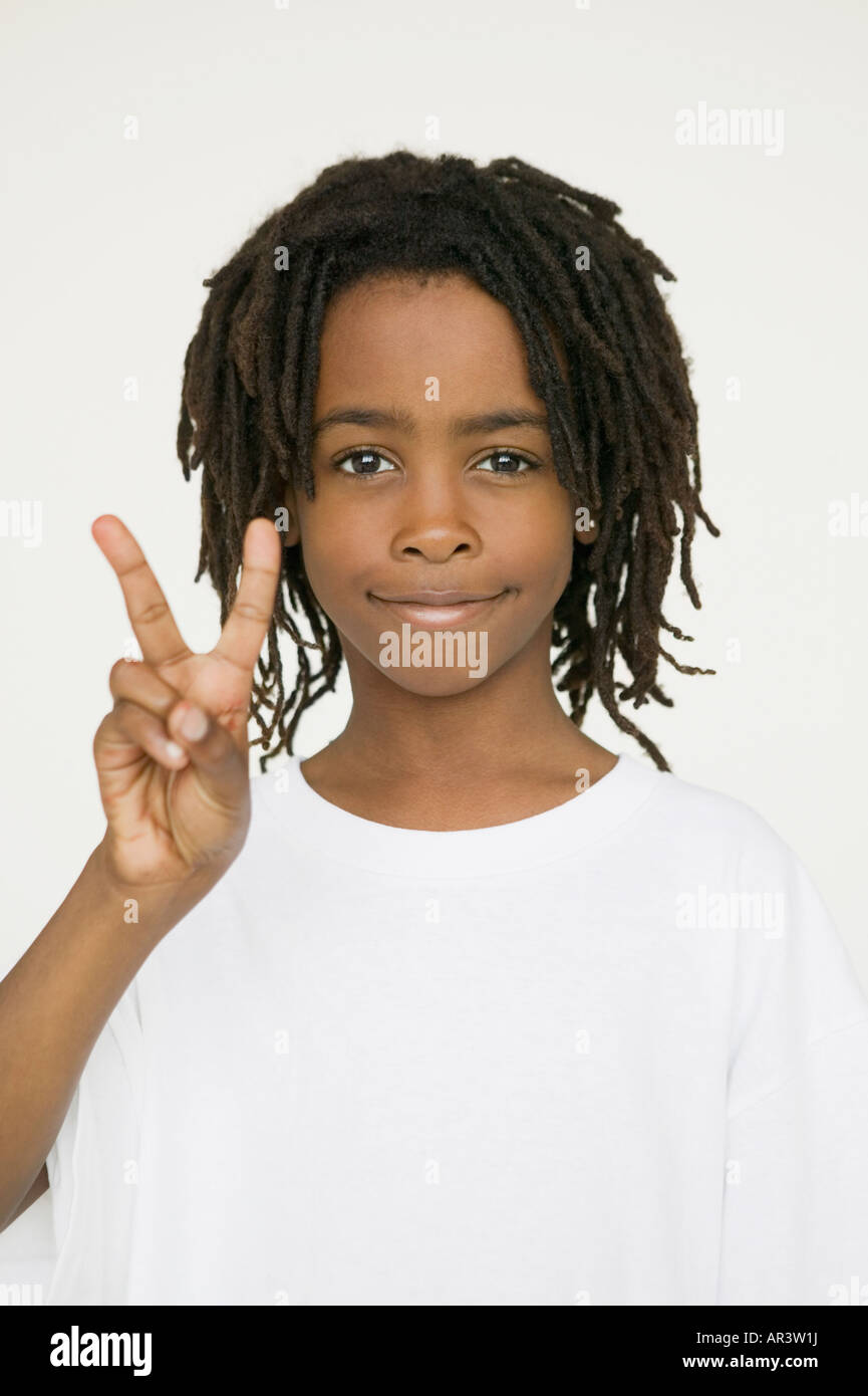 African boy making peace sign with hand Stock Photo - Alamy