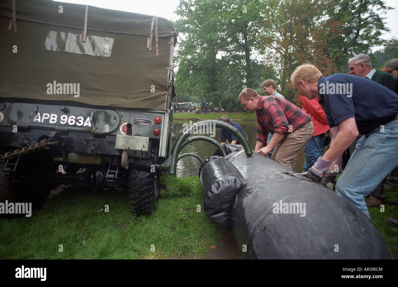 Attaching the flotation bags to a historic 1963 APGP amphibious Land ...